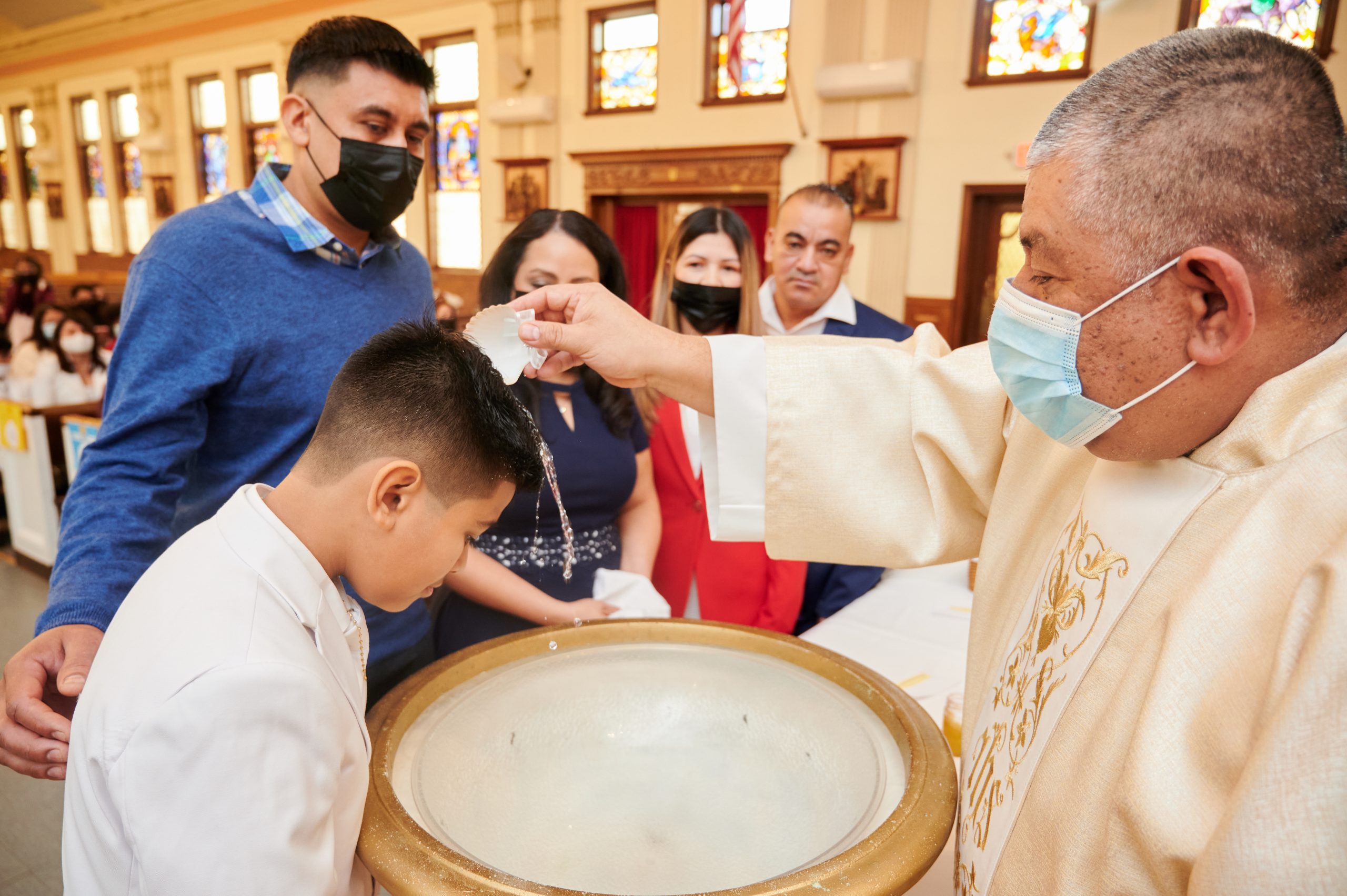 First Holy Communion Students Receive Baptism – Our Lady of Loretto